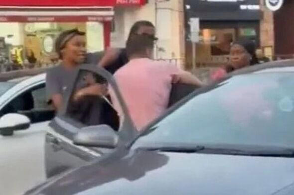 Moment chaos erupts in lawless London as 'road rage' drivers fight in ...