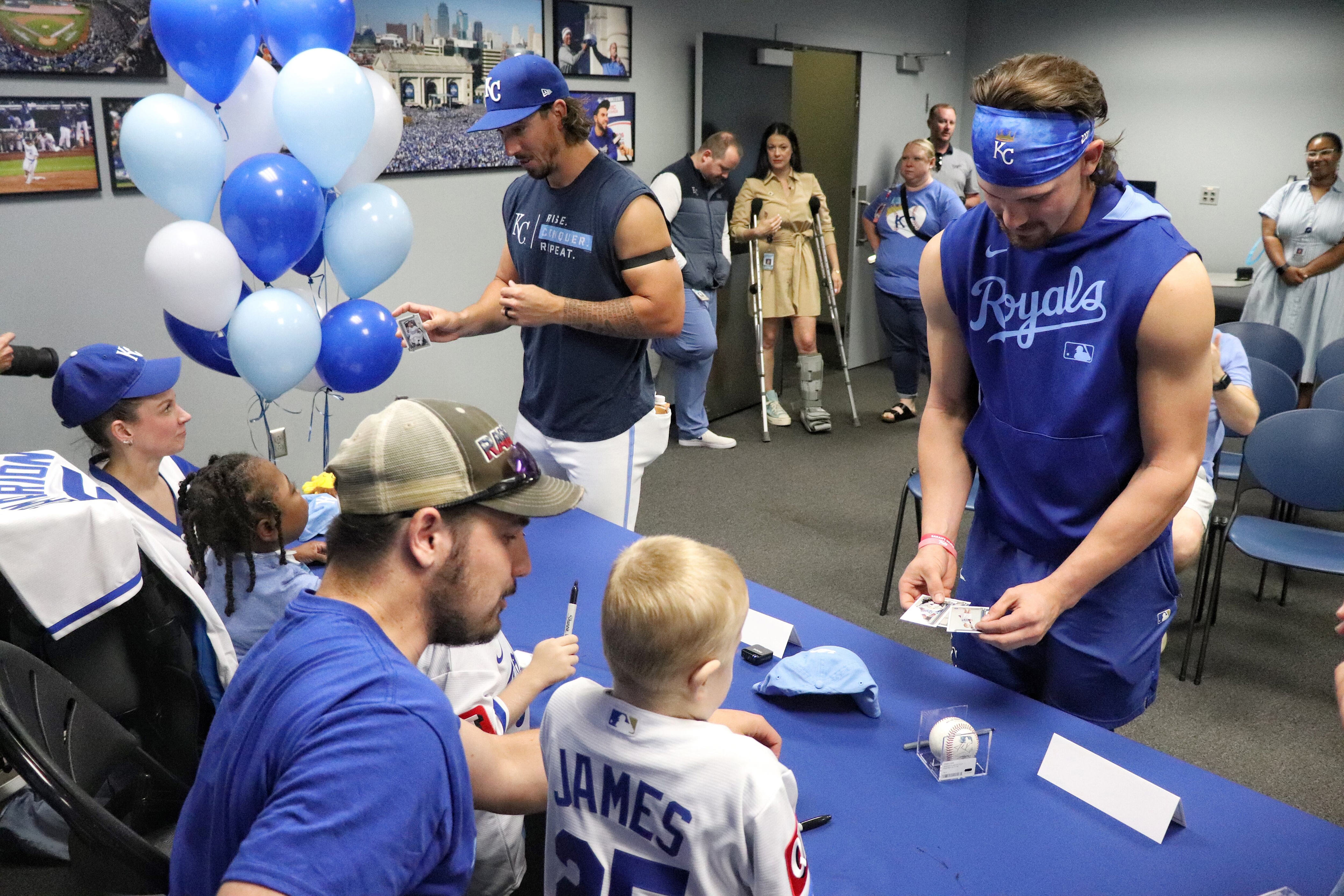 Kids sign autographs for Royals players in role reversal