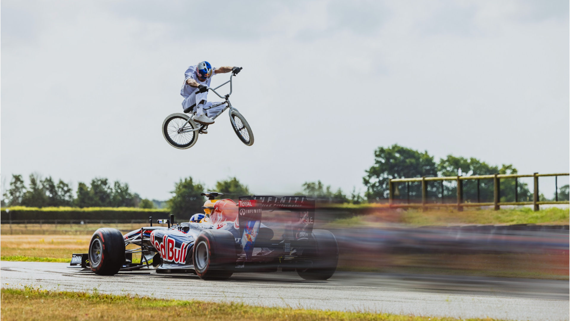 Scottish Bmx Rider Kriss Kyle Bunny Hops Over Speeding F1 Car