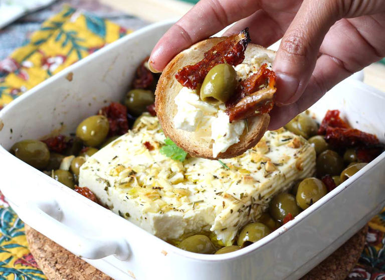 Baked feta with dried tomatoes and olives, mediterranean style