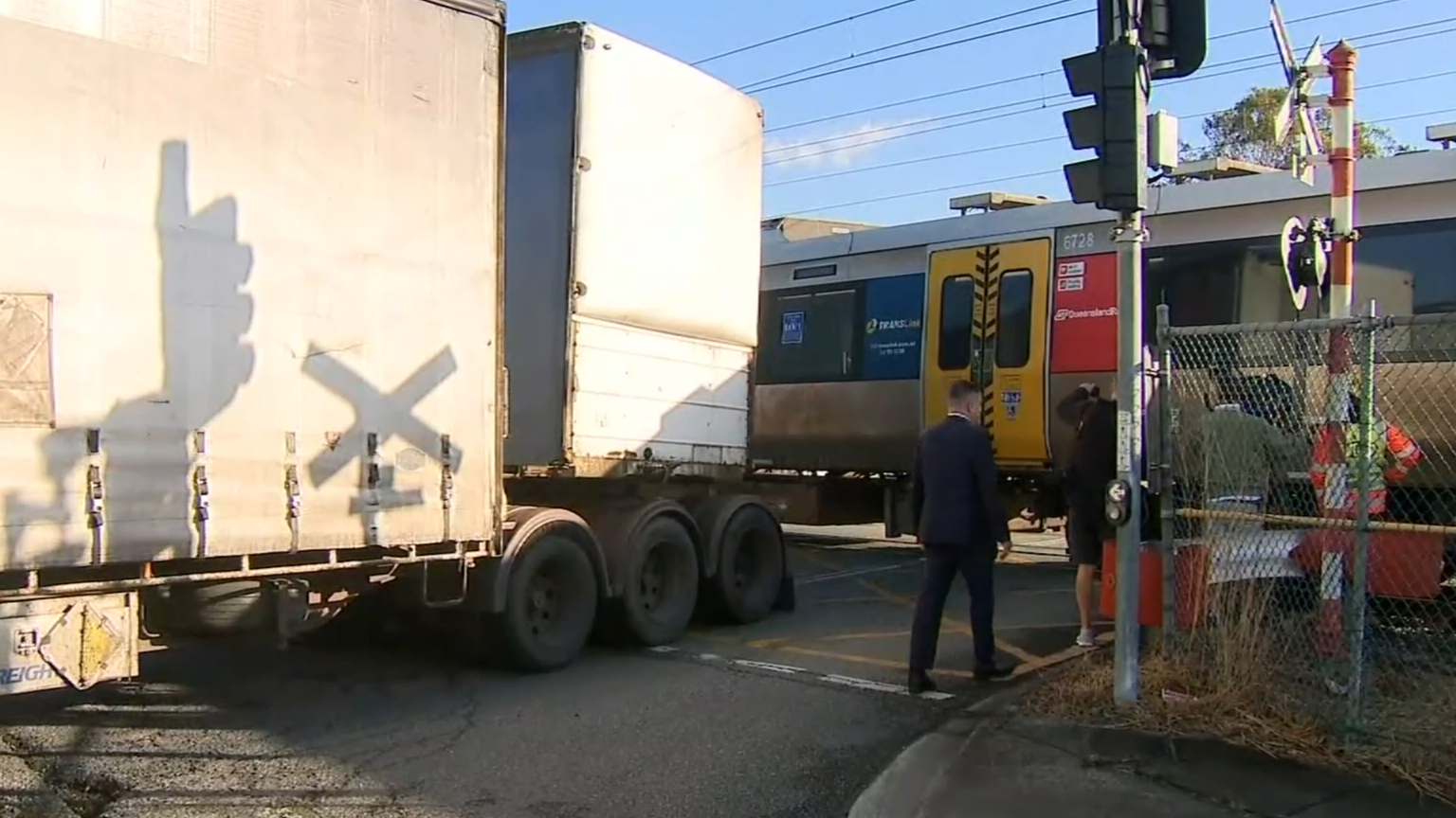 Train with 300 passengers collides with truck on tracks in Brisbane