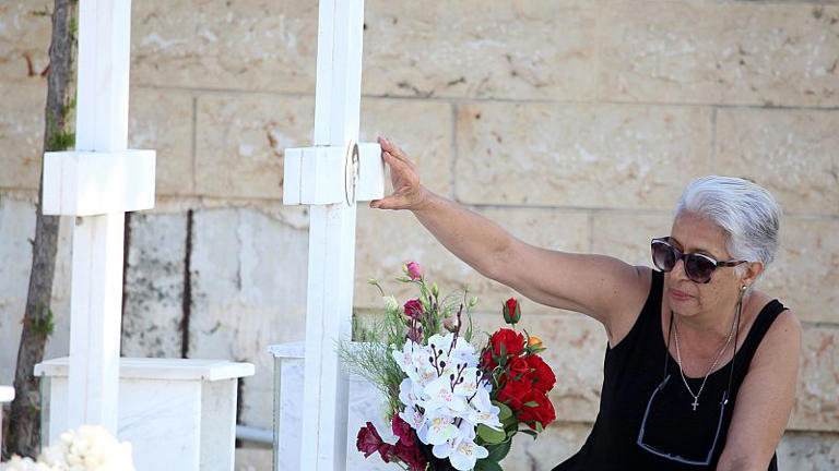 Greek and Turkish Cypriots unite to restore cemeteries along Green Line