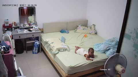 China: Grandfather Leaps to Catch Baby Seconds Before Falling off Bed
