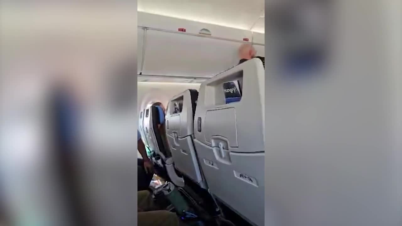 Video shows man escorted off Norfolk Breeze flight