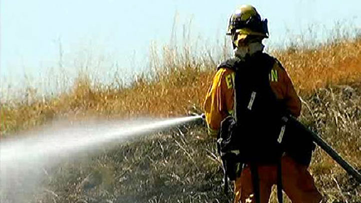 Brush fire burns in Action, threatens structures