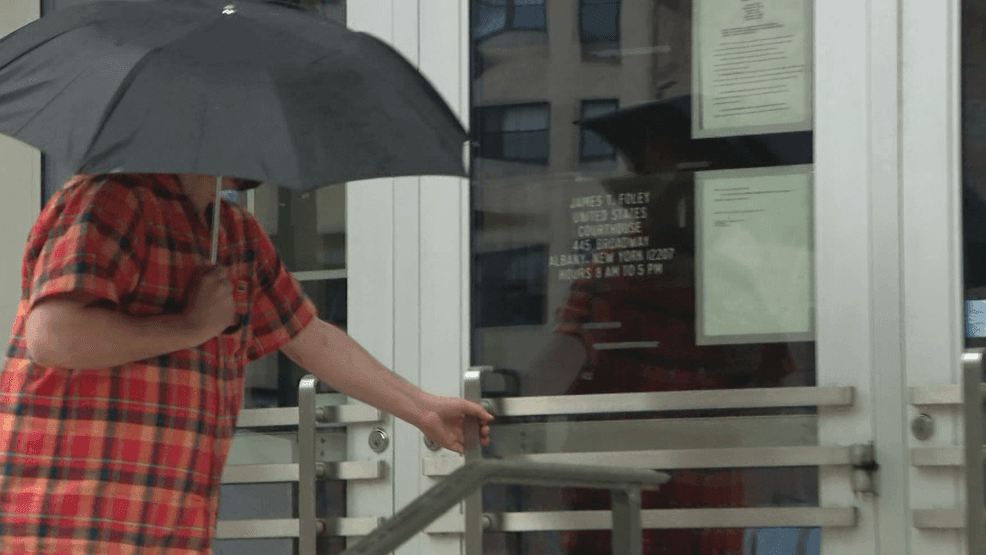 Man charged with harassing family of murdered CEO now on leave from DOH