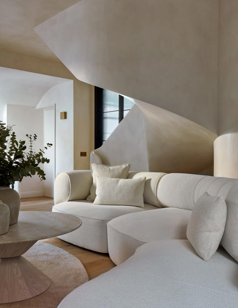 Sculptural staircase forms centrepiece of renovated London home by ...