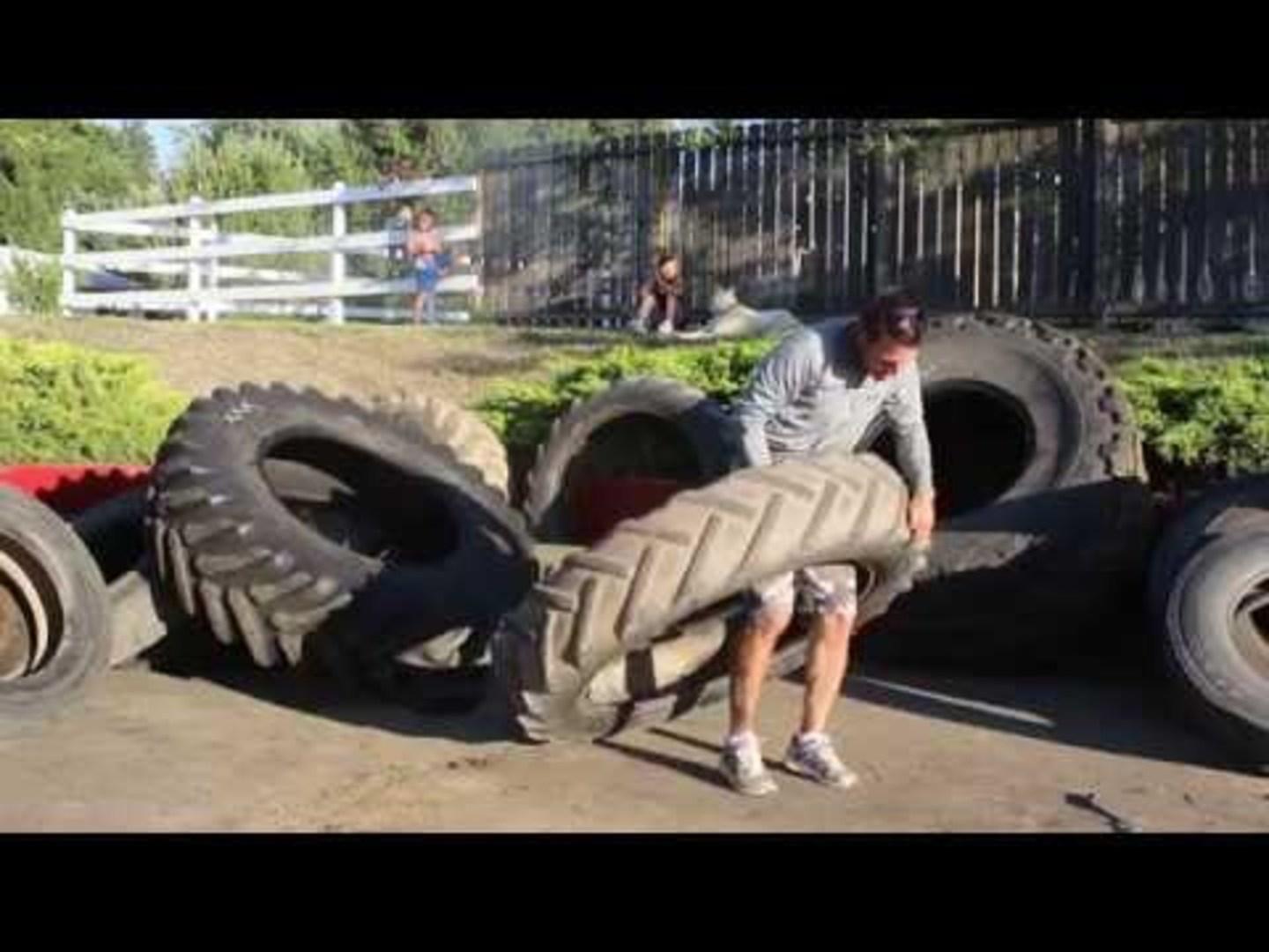 Man Uses Giant Tire as Hula Hoop