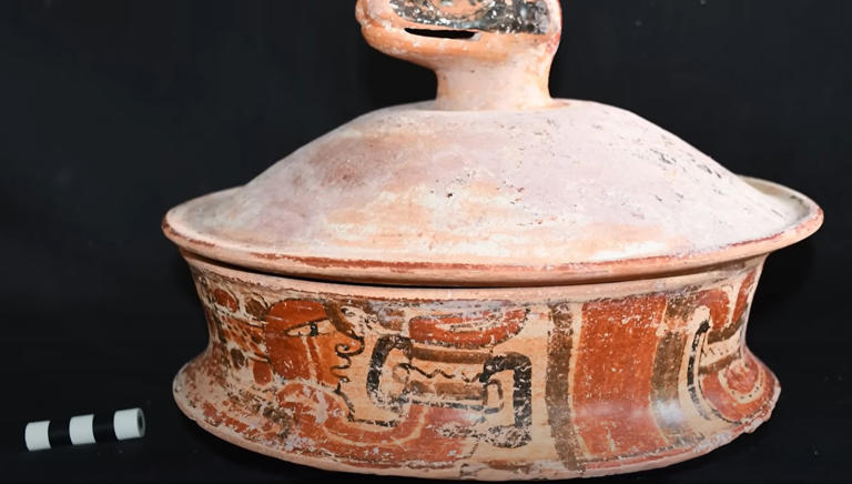Archaeologists exploring in the shadow of an ancient Maya pyramid ...