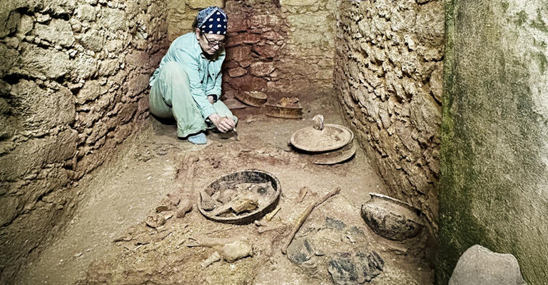 Archaeologists exploring in the shadow of an ancient Maya pyramid ...