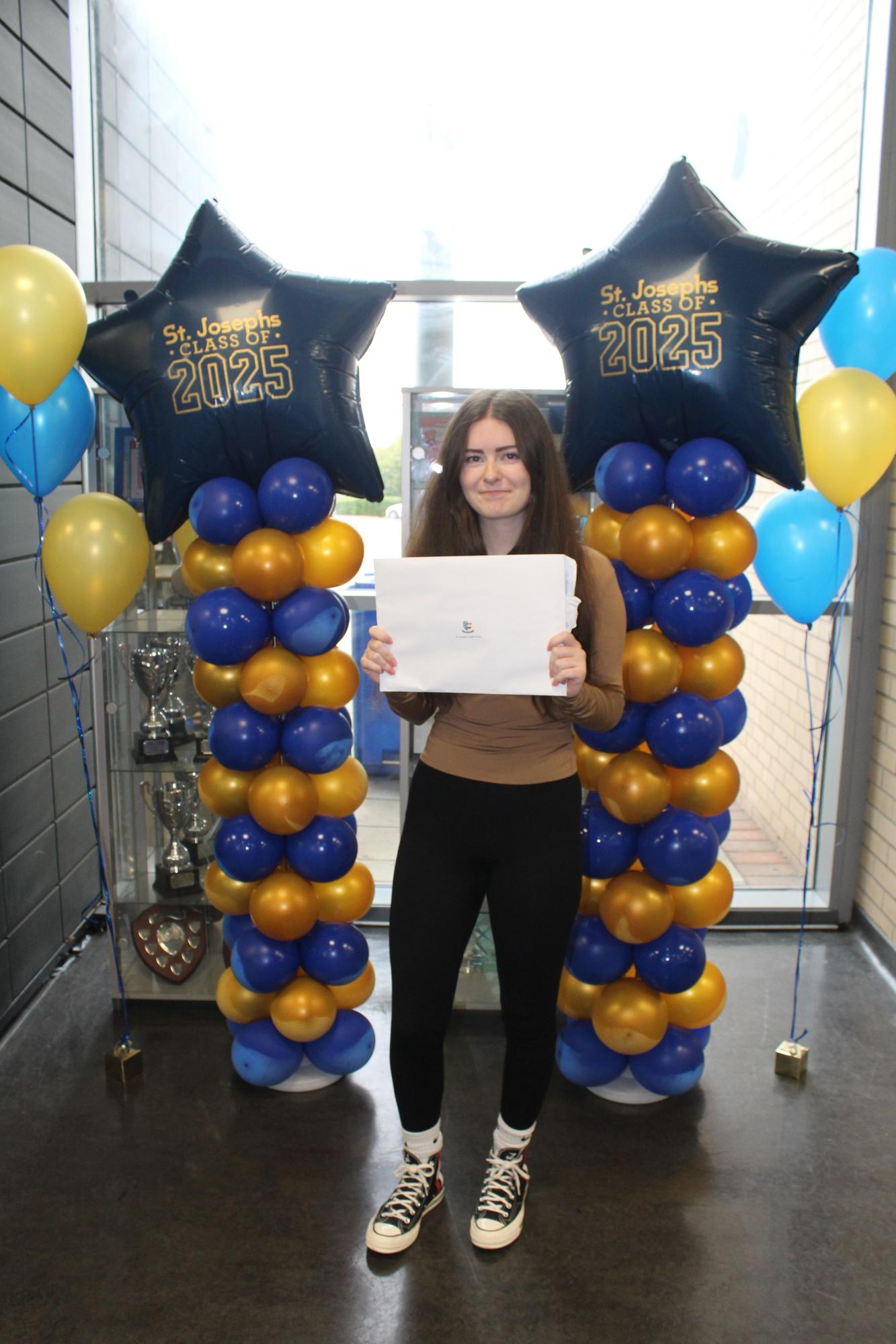 Excited GCSE students celebrate their results in Hebburn