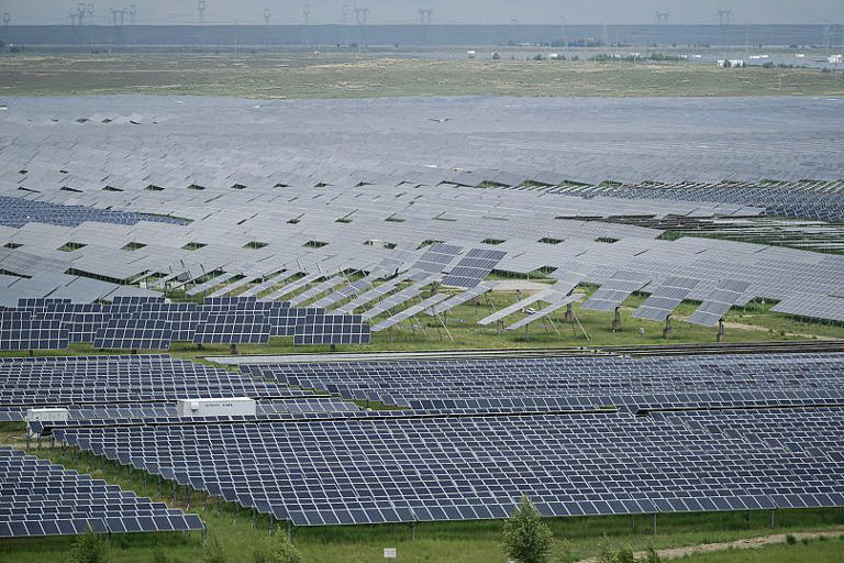 China races to build the world's largest solar farm to meet emissions ...