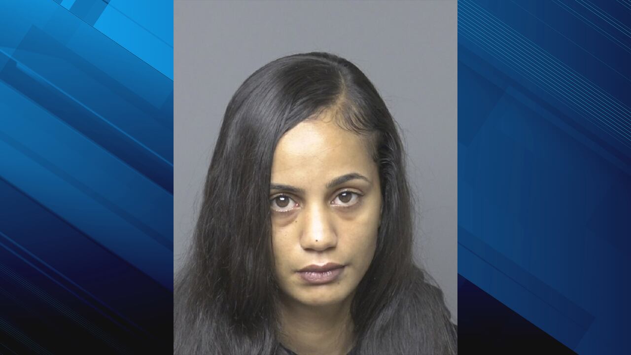 Woman charged after maintenance worker found dead dog in garbage bag