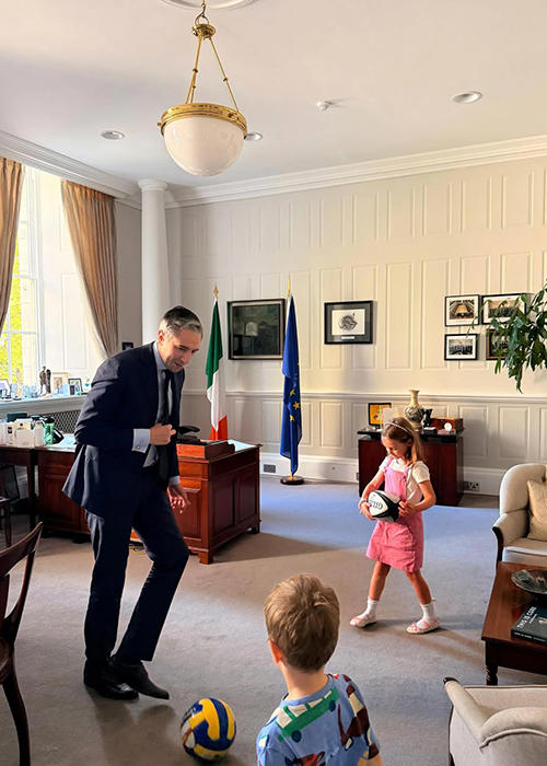 Daddy Day Care! Simon Harris' kids have a blast in his office