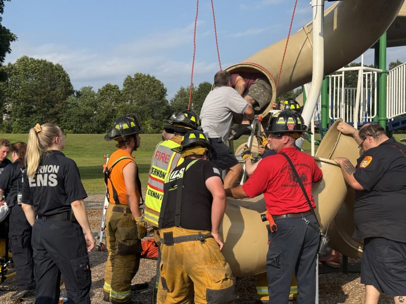 First responders in Connecticut rescue man stuck in playground slide ...