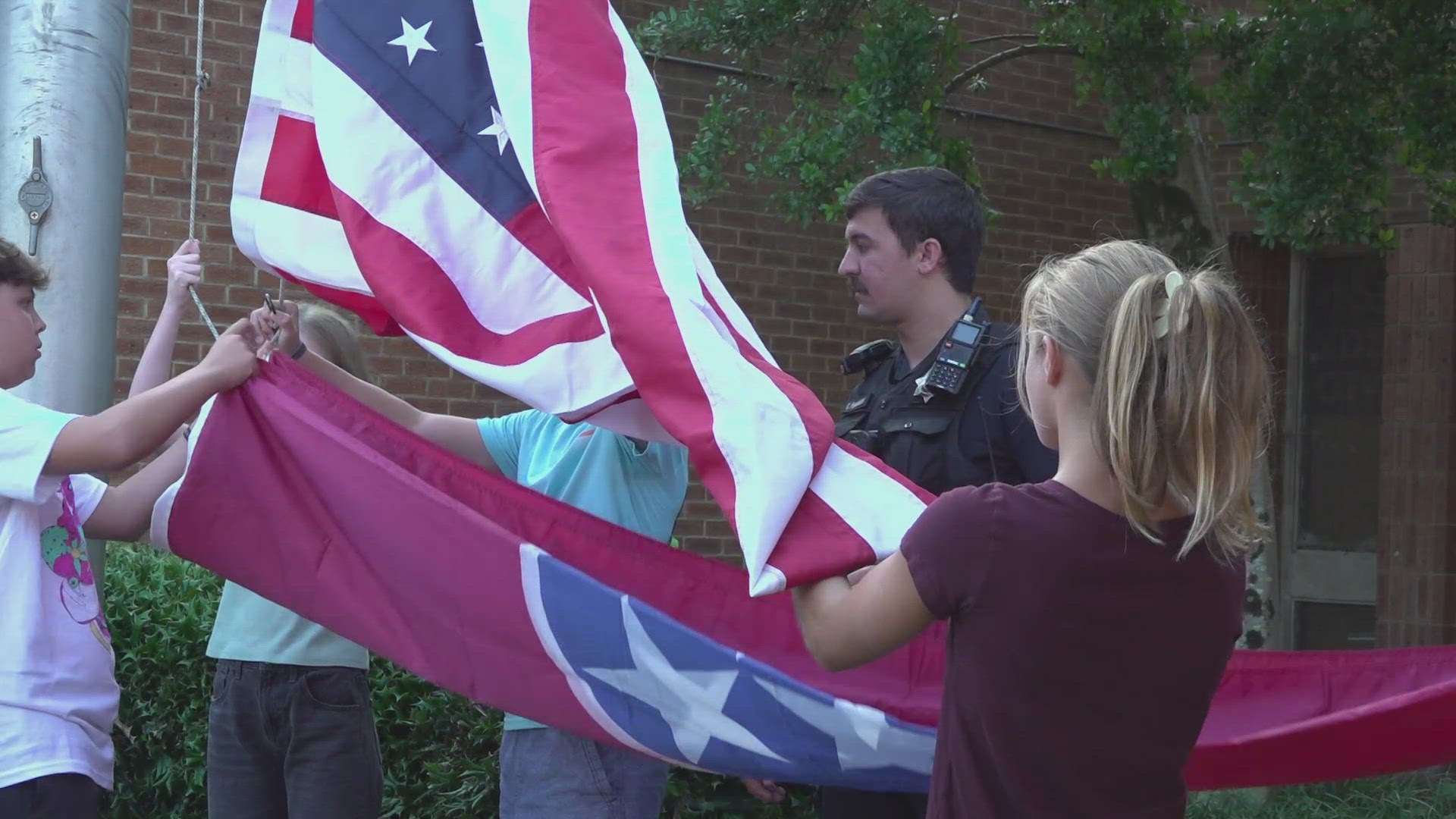 Loudon County students being taught how to properly raise and lower the ...