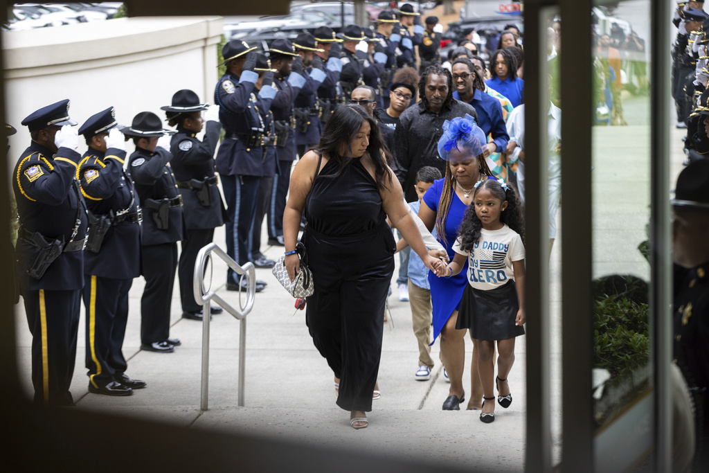 Law enforcement officers remember police officer killed in CDC shooting ...