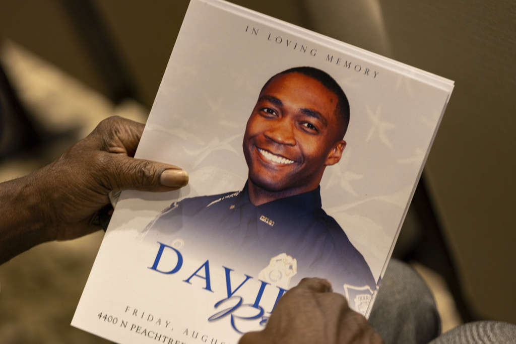 Law enforcement officers remember police officer killed in CDC shooting ...