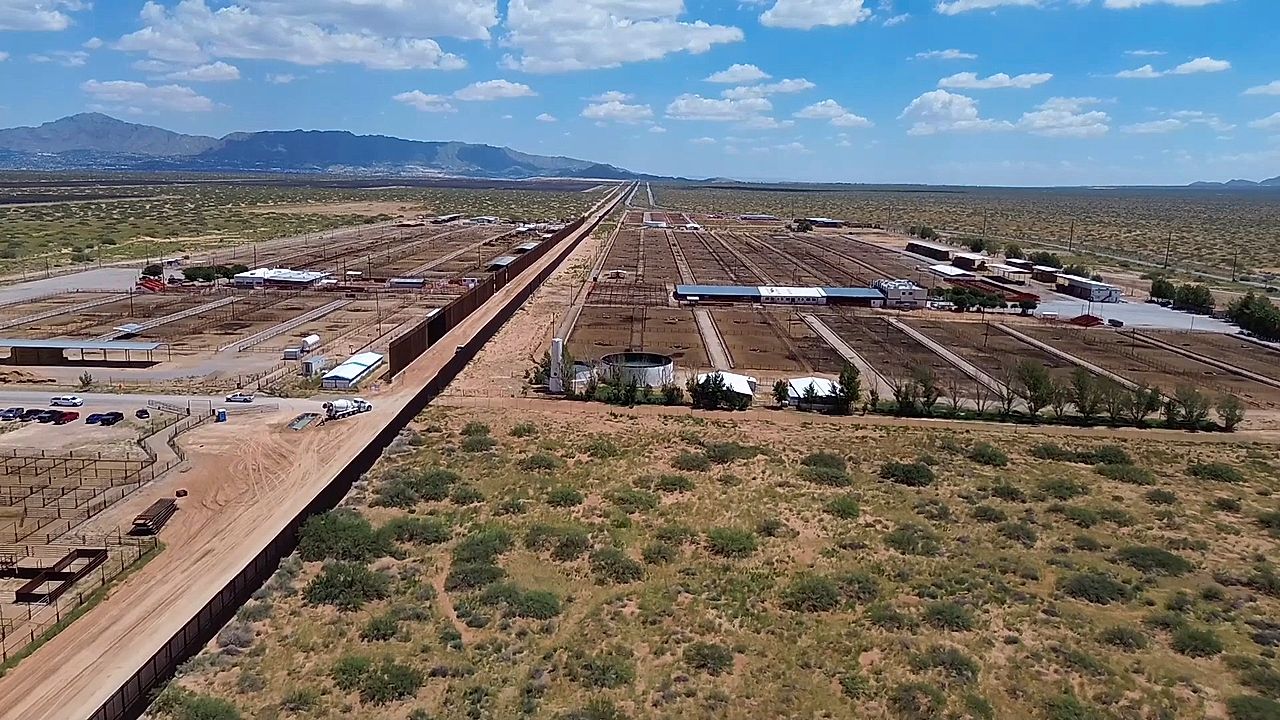 US border wall painted black to deter crossings near Ciudad Juarez