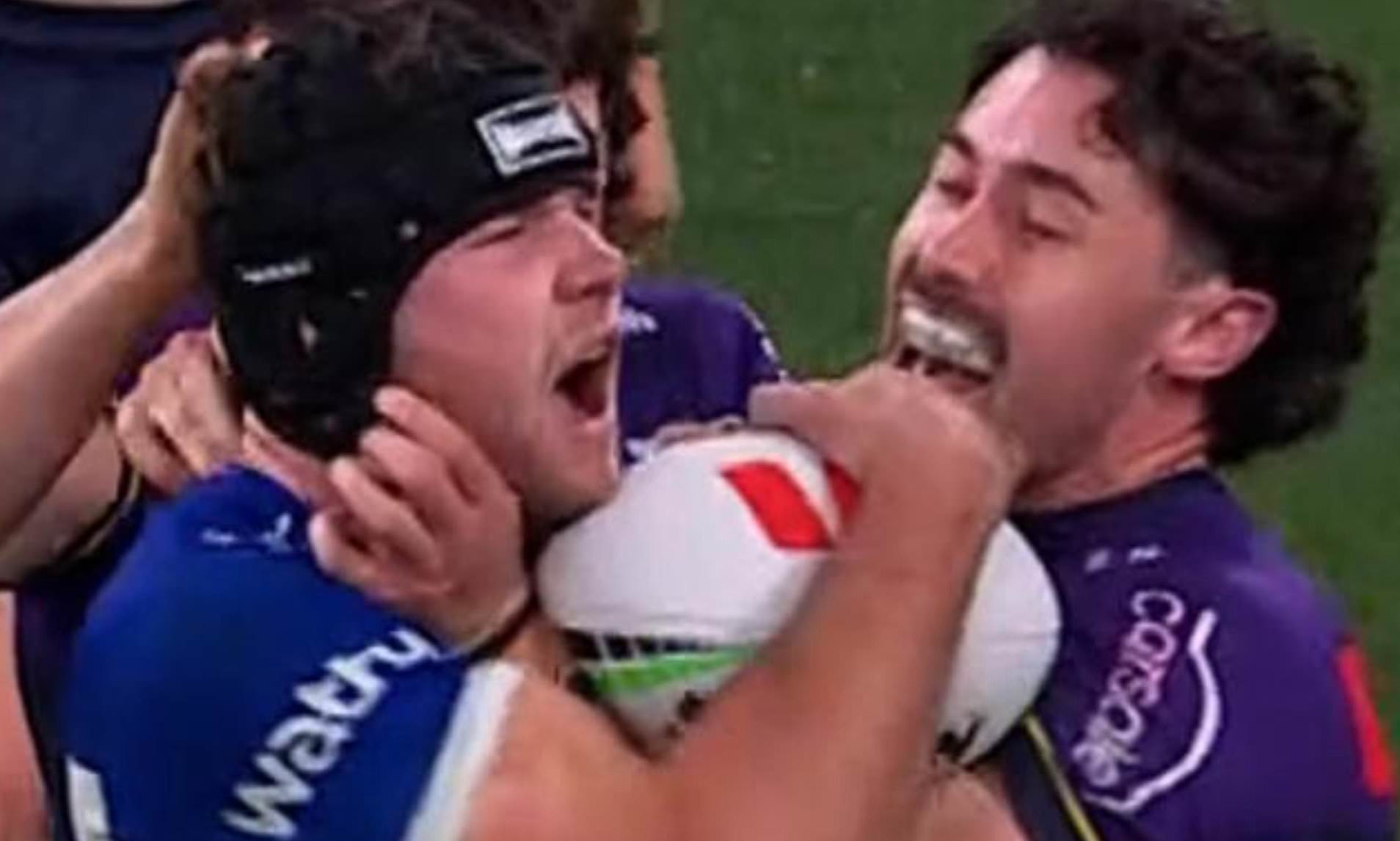 Footy fans stunned after bizarre penalty for 'head rub' as Melbourne ...