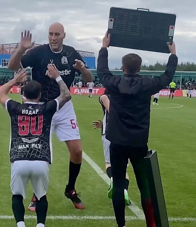 Meet the TALLEST footballer - nearly a foot bigger than Peter Crouch ...