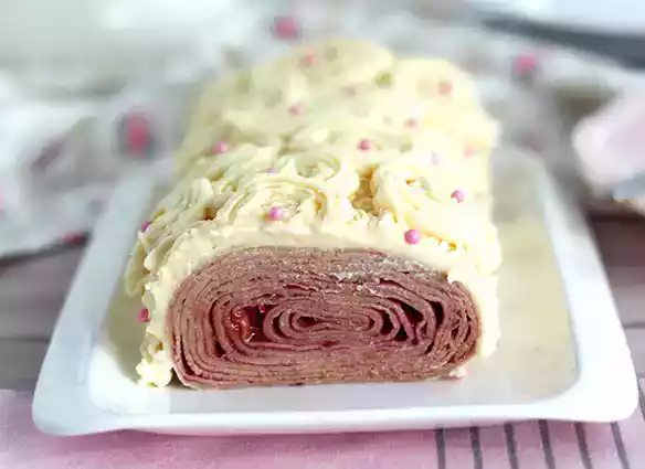 Crepe yule log with raspberry and white chocolate