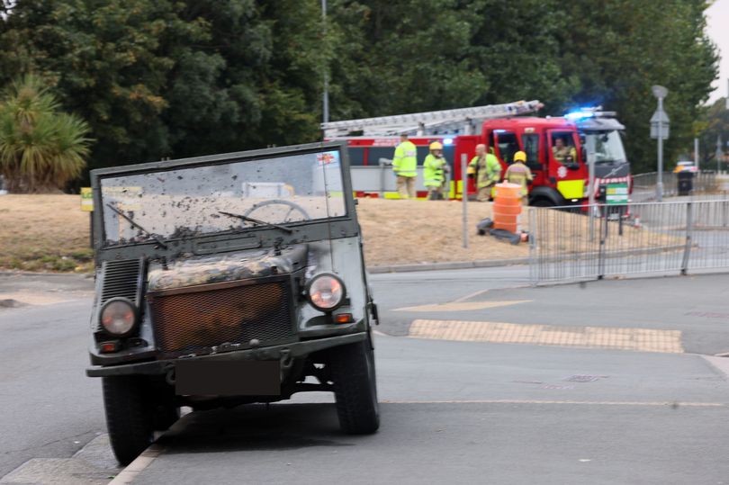 Vintage jeep catches fire at busy town centre roundabout