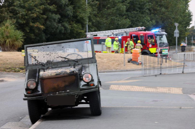 Vintage jeep catches fire at busy town centre roundabout