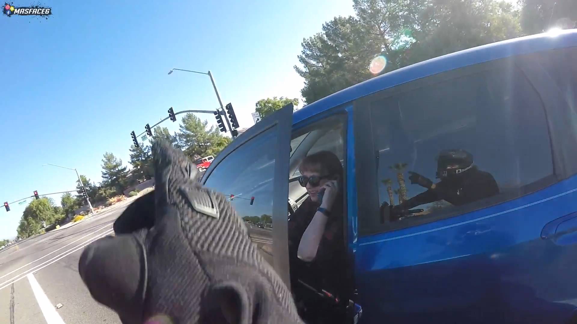 Biker pushes disabled car out of roadway