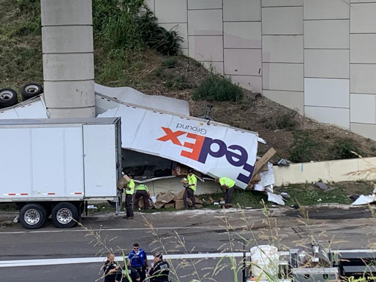 At least 1 dead after semi truck flips onto side, closes parts of busy highway in Dayton