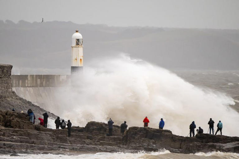 Warning after huge waves knock people into boulders at popular seaside ...