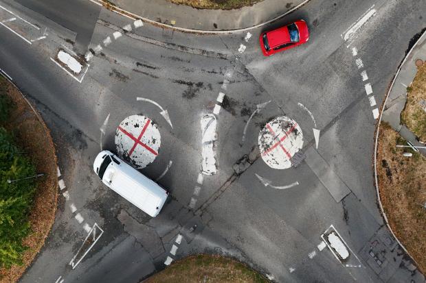 St George's cross flags painted on mini-roundabouts in Bucks village