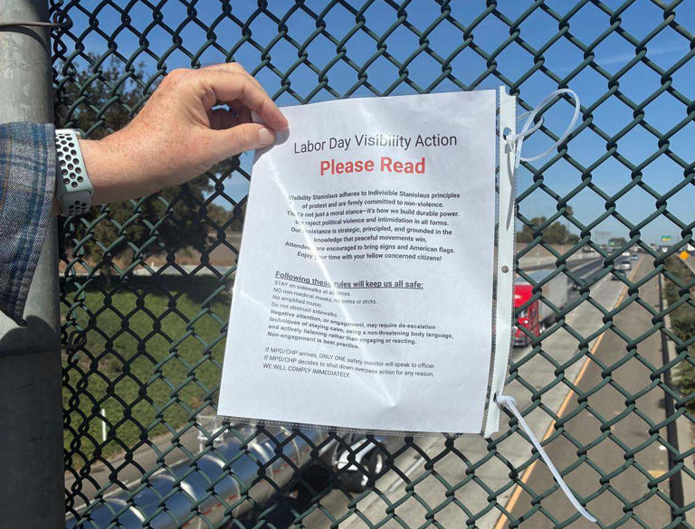Signs above Highway 99 in Modesto bring more eyes to anti-Trump protest