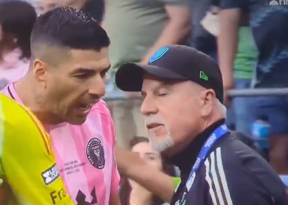 Luis Suarez sparks brawl after spitting on coach