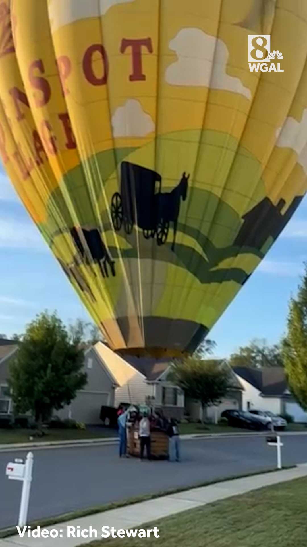 LOOK OUT BELOW! | Hot-air balloon lands in middle of street