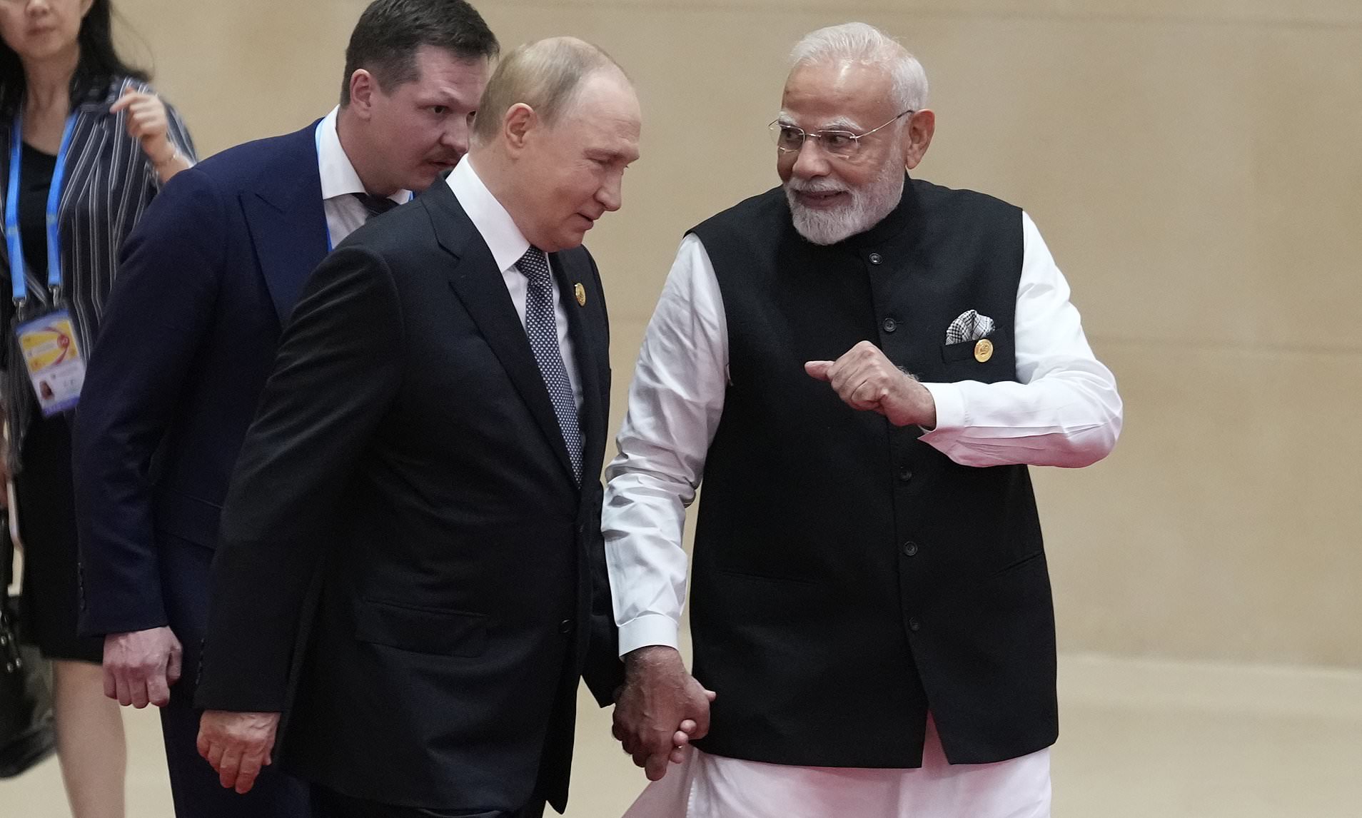 Putin and Modi walk hand-in-hand into China's anti-NATO summit