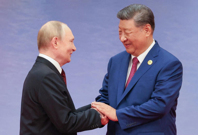 India’s leader Modi cozies up to Putin and Xi Jinping at Shanghai ...