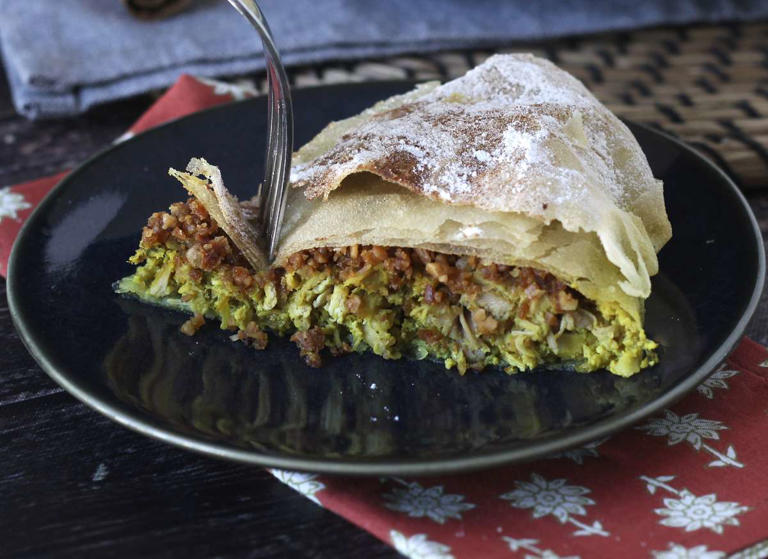 Traditional moroccan pastilla with phyllo dough, chicken and spices