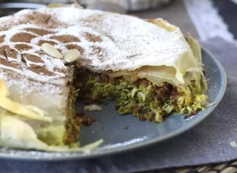 Traditional Moroccan pastilla with phyllo dough, chicken and spices