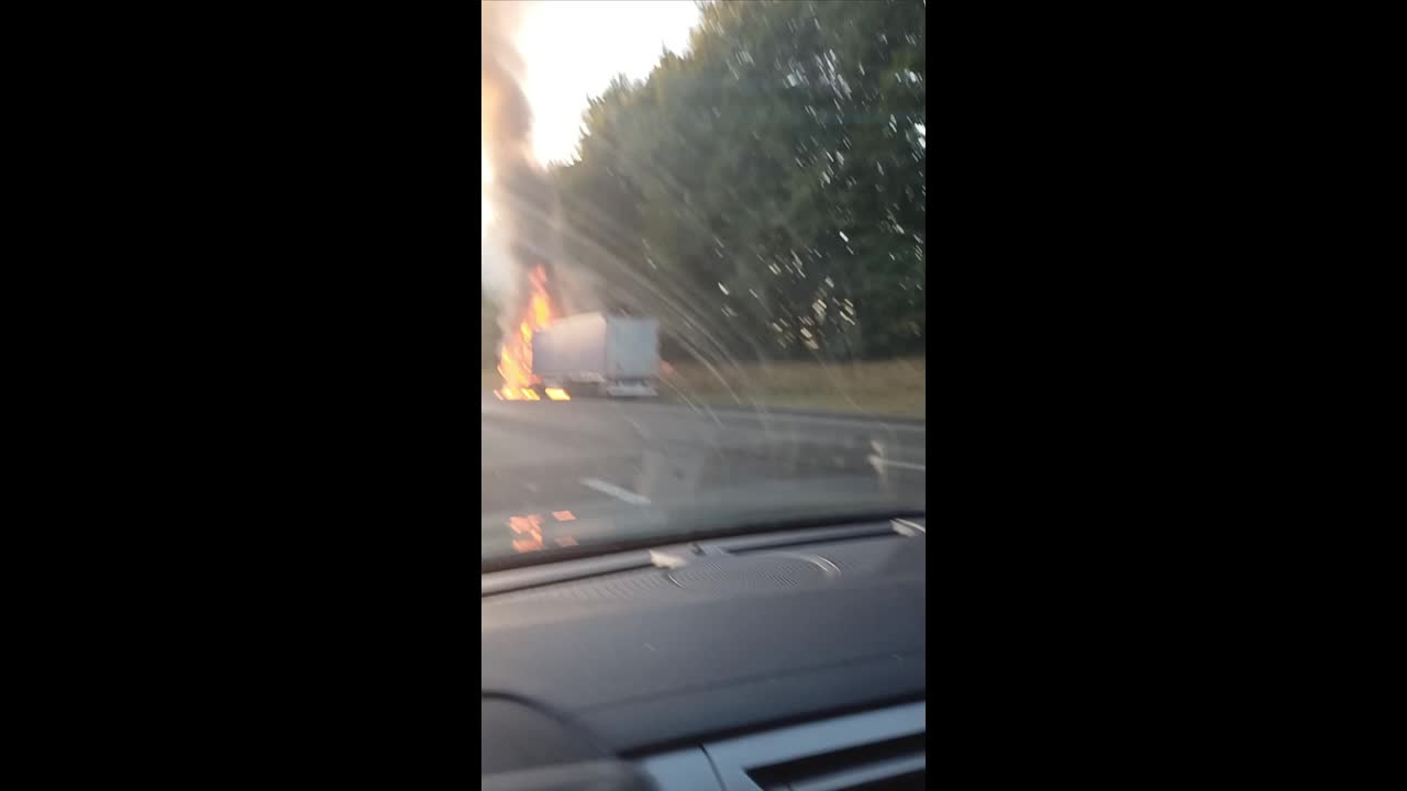 Truck's tyre explodes as motorist drives past vehicle engulfed in ...