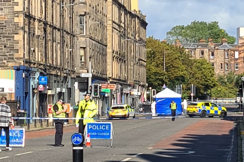 Police and forensics comb Edinburgh street amid alleged 'stabbing'