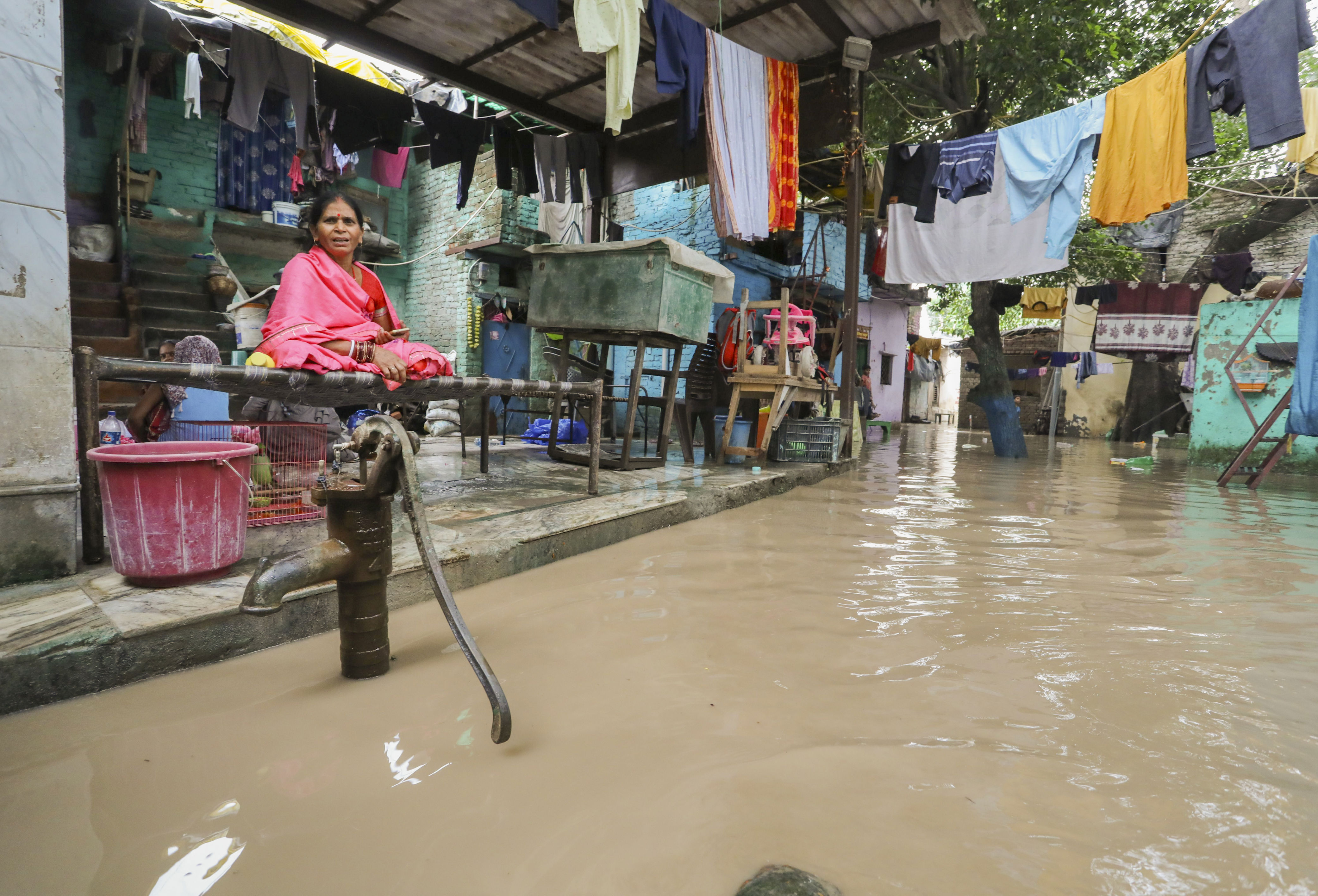 Cots float, families wade through water as Yamuna rises in Delhi
