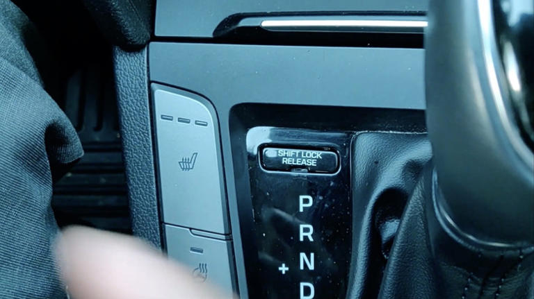 What Is The Little Button Next To Your Car's Gear Shift For?