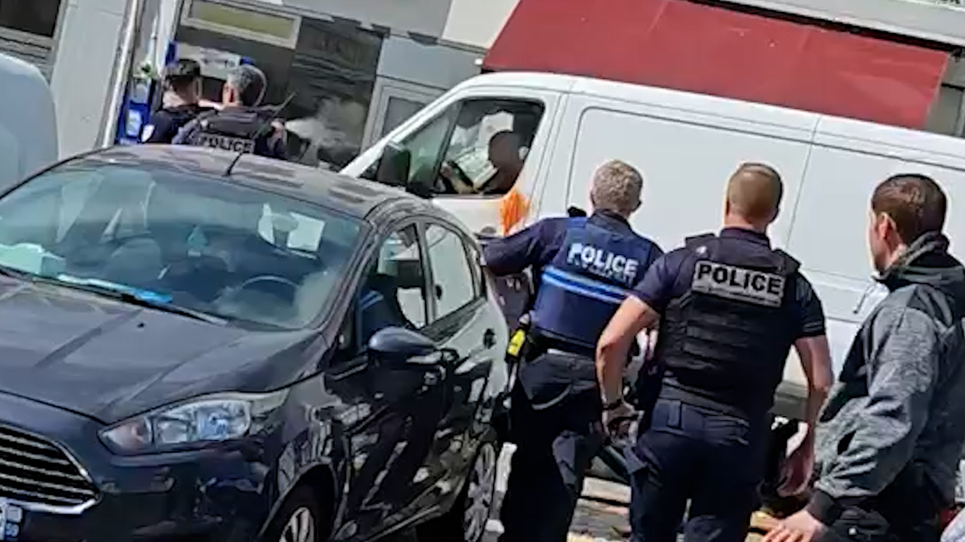 Shocking video shows suspect attempting to evade police in white van