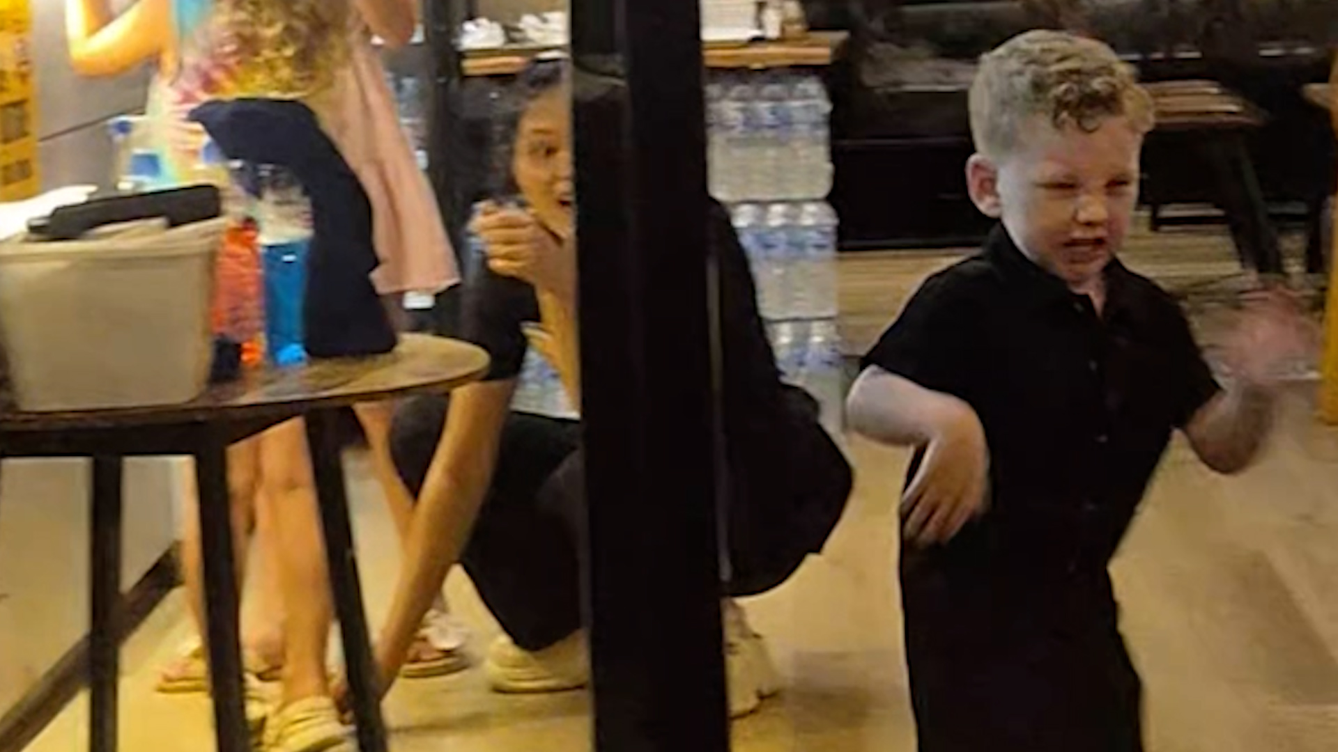 Little boy runs face-first into a glass door