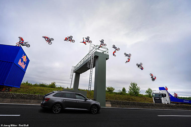 Watch the incredible moment motorcycle rider jumps between two moving ...