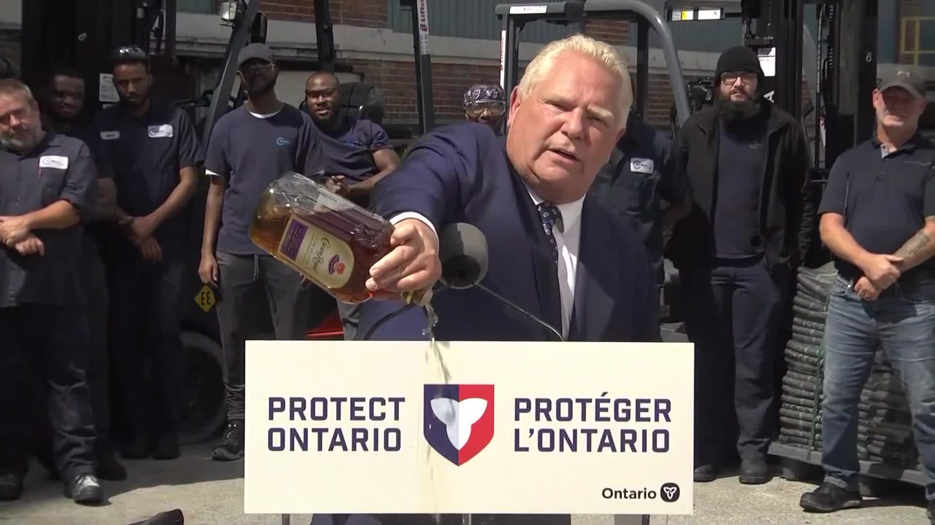 Doug Ford pours out a bottle of Crown Royal over job cuts