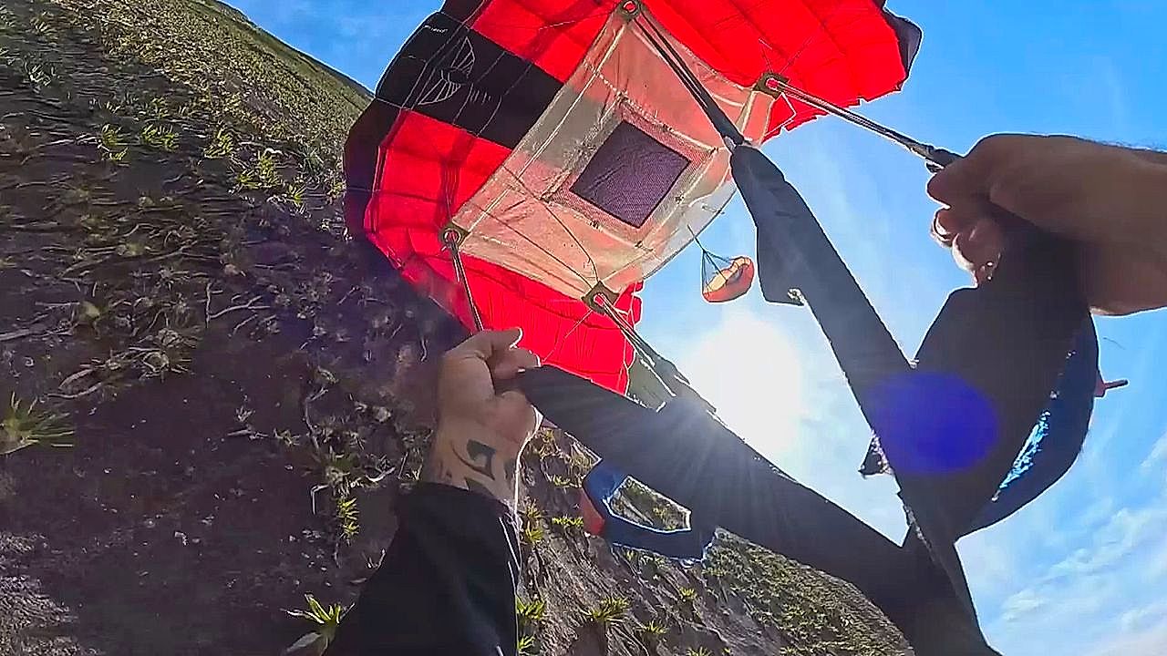 Military firefighter survives terrifying cliff base jump crash