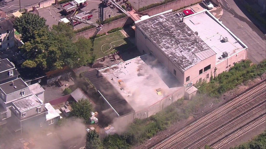 Forklift crash inside Yonkers warehouse caused chemical reaction, fire ...