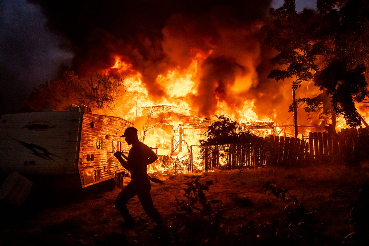 Homes destroyed as quick-moving wildfire burns through historic ...